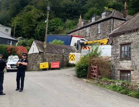 Work begins to free haulage truck stuck in narrow lane at Forder in ...